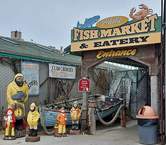 The unassuming blue exterior of Phil's Fish Market & Eatery stands like a salty sea captain – weathered, unpretentious, and hiding treasures within.