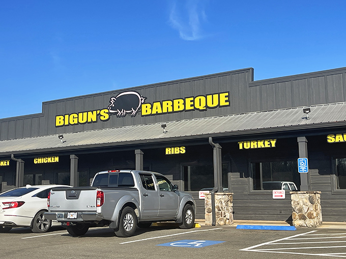 The rustic wooden exterior with bold yellow signage announces its purpose without pretense – this is barbecue country, and Bigun's means business.