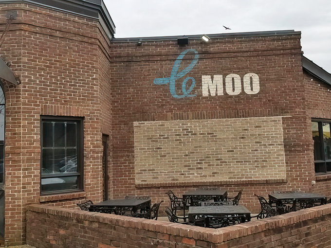 The brick façade of Le Moo welcomes hungry visitors like a carnivore's storybook cottage. Rustic charm meets upscale dining at Louisville's premier steakhouse destination.