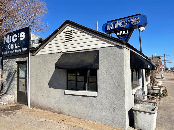 The unassuming exterior of Nic's Grill looks like any other house on the block—until you spot that sign promising burger nirvana inside.