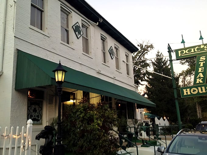 The unassuming green exterior of Pat's Steakhouse hides culinary greatness like a superhero's secret identity. That modest sign has guided hungry Louisvillians for generations.