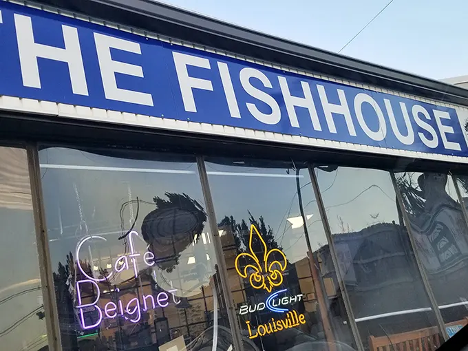 The unassuming exterior of The Fish House belies the seafood treasures within. Blue signage and simple storefront—culinary magic happens here.