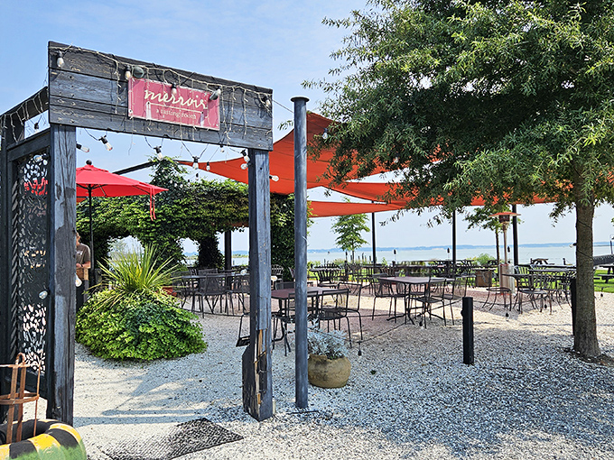 Merroir's unassuming exterior belies the culinary magic within. Those orange umbrellas aren't just for shade—they're beacons guiding seafood pilgrims to paradise.