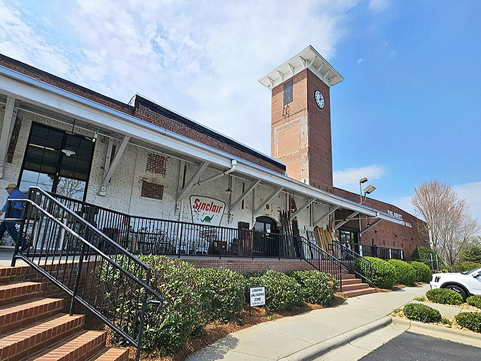 The imposing brick facade and clock tower of Gibson Mill stands as a sentinel of history, transformed from textile production to treasure hunting headquarters.