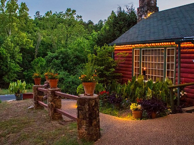 The rustic red cabin exterior isn't trying to impress anyone—until you taste what's inside. Ozark charm at its most delicious.