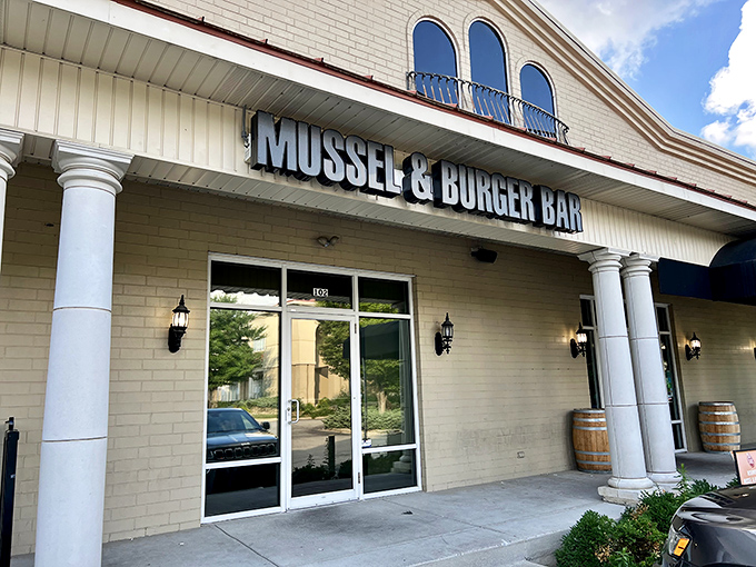 The unassuming exterior of Mussel & Burger Bar belies the culinary treasures within. Like finding a diamond in a strip mall setting.