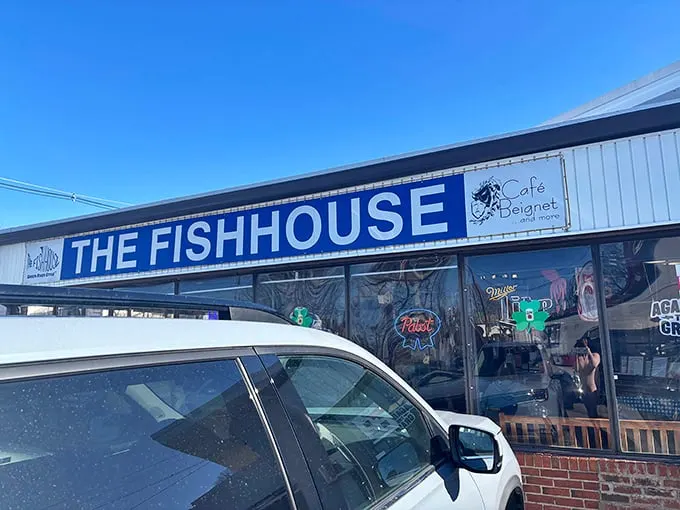 The unassuming exterior of The Fish House belies the seafood treasures within. Blue signage and simple storefront—culinary magic happens here.