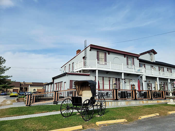 Colonial charm meets Maryland hospitality at the Carriage House Inn's pristine exterior, where that American flag isn't just decoration—it's a promise of classic American cuisine inside.