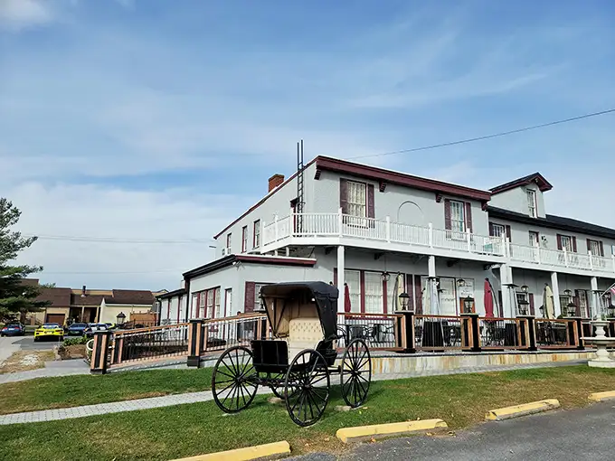 Colonial charm meets Maryland hospitality at the Carriage House Inn's pristine exterior, where that American flag isn't just decoration—it's a promise of classic American cuisine inside.