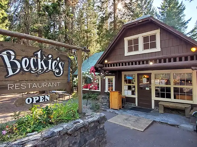 Nestled among towering pines, Beckie's rustic cabin exterior promises woodland charm and homestyle comfort before you even step inside.