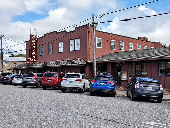 The iconic rose-colored exterior of Duarte's Tavern stands like a culinary lighthouse on Pescadero's main drag, beckoning hungry travelers since 1894.