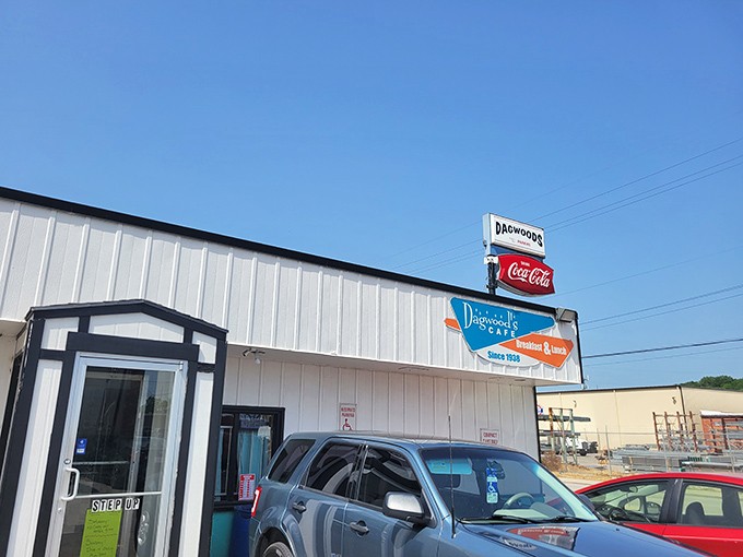 The unassuming exterior of Dagwood's Cafe stands as a beacon to breakfast lovers, its vintage turquoise trim and classic signage promising authentic diner delights within.