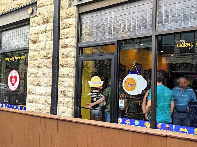 The limestone facade of The Chef welcomes hungry patrons with its cheerful egg-shaped "Open" sign—a promise of good things to come inside.
