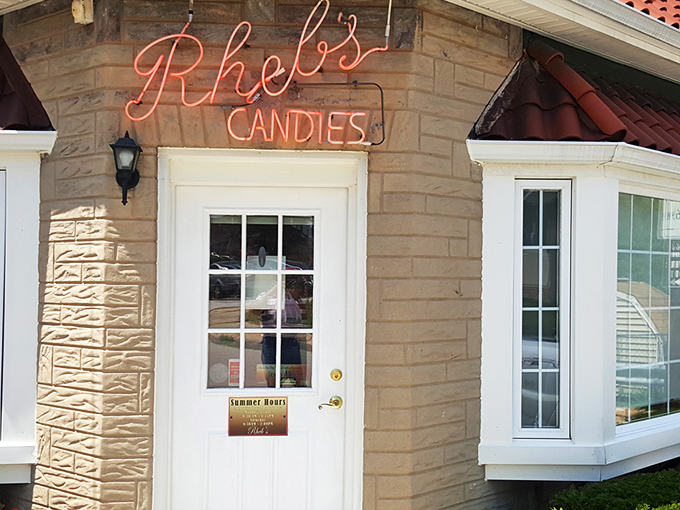 That glowing neon sign isn't just advertising candy—it's a beacon of sweetness that's been guiding Baltimoreans to chocolate bliss for generations.