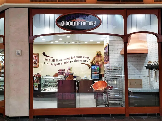 The gateway to chocolate heaven beckons with its warm wooden archway. Once you cross this threshold, all diet-related promises become delightfully negotiable.