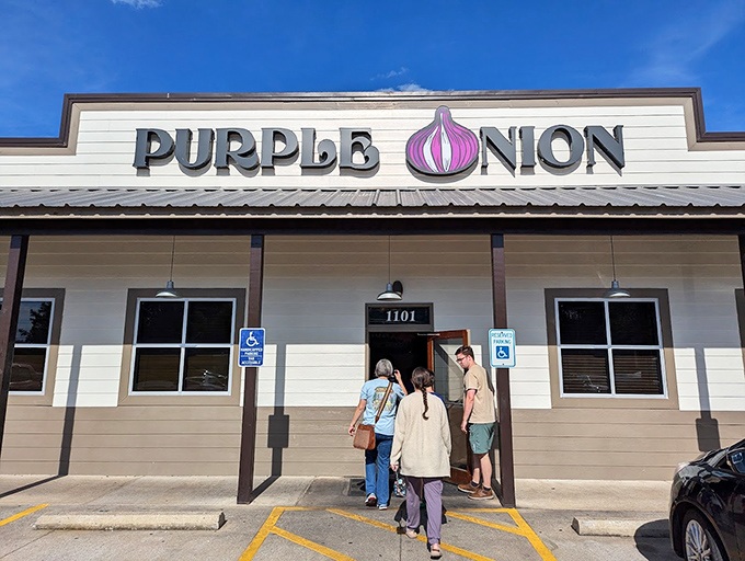 The Purple Onion's exterior beckons with its playful signage – that giant purple bulb is basically saying, "Good food happens here, folks!"