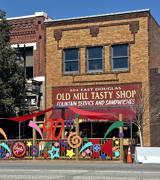 The brick storefront with its vintage red awning isn't just preserving history—it's practically a time portal to 1932 Wichita with better sandwiches.