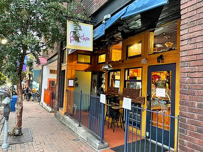 Bouchon's cheerful blue awning and warm wooden façade beckon like a Parisian whisper on Asheville's eclectic Lexington Avenue.