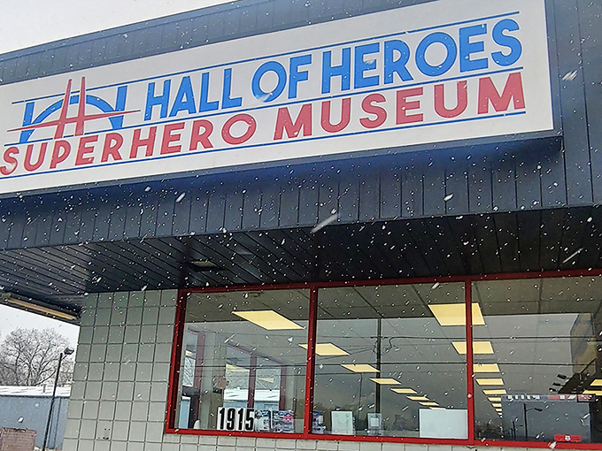 The unassuming exterior belies what waits inside - a façade featuring iconic superhero emblems that serve as a bat-signal to comic enthusiasts everywhere.