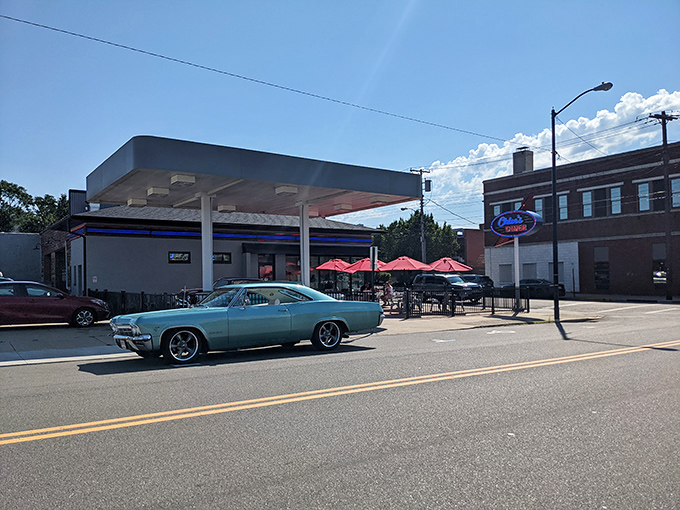 The classic gas station-turned-diner exterior isn't just nostalgic—it's a promise that what awaits inside will fuel more than just your car.
