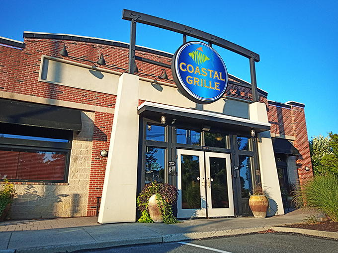 The bold blue signage against brick serves as a beacon for seafood lovers, like a lighthouse guiding hungry sailors to safe harbor.