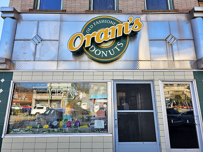 The green and gold storefront beckons like a lighthouse for the sugar-deprived. Since 1938, this humble facade has witnessed countless donut pilgrimages.