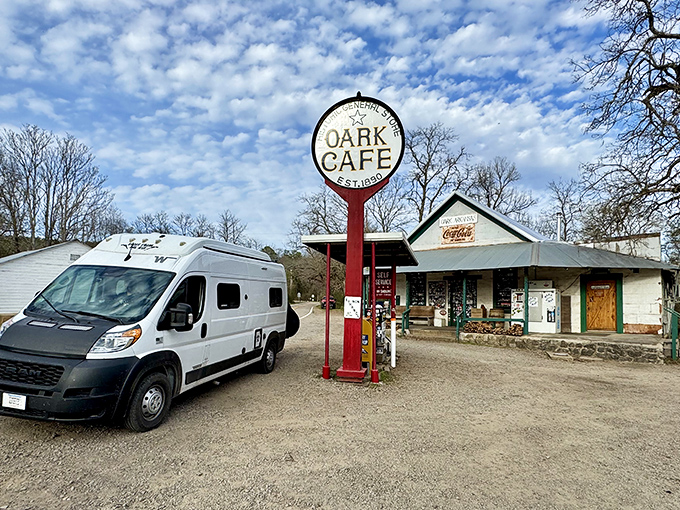The pilgrimage begins here – a humble white building with a vintage Oark Cafe sign that's drawn road-trippers and hungry adventurers for generations.