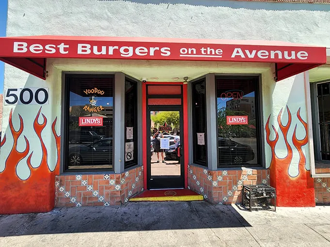 The unassuming brick exterior of Lindy's on 4th, complete with flame accents, stands as Tucson's temple to burger excess. Greatness often hides in plain sight.