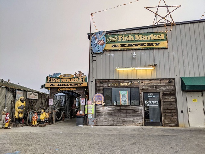 The unassuming blue exterior of Phil's Fish Market & Eatery stands like a salty sea captain – weathered, unpretentious, and hiding treasures within.