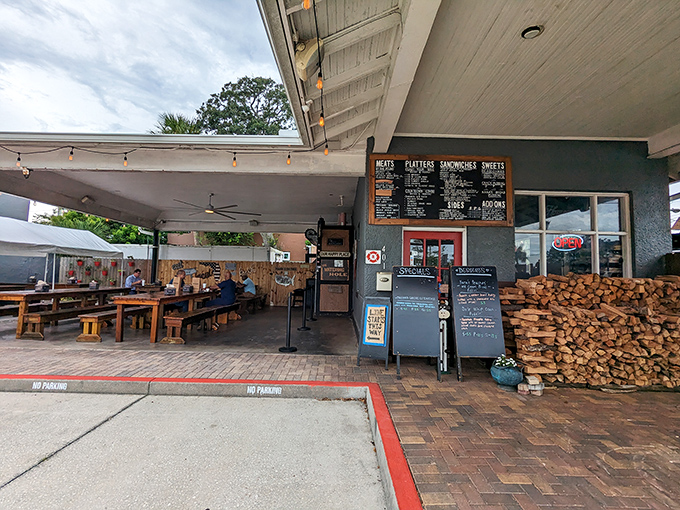 The unassuming exterior of Crydermans hides barbecue greatness like a superhero's secret identity. Stacked firewood isn't decor—it's a promise of smoky deliciousness to come.