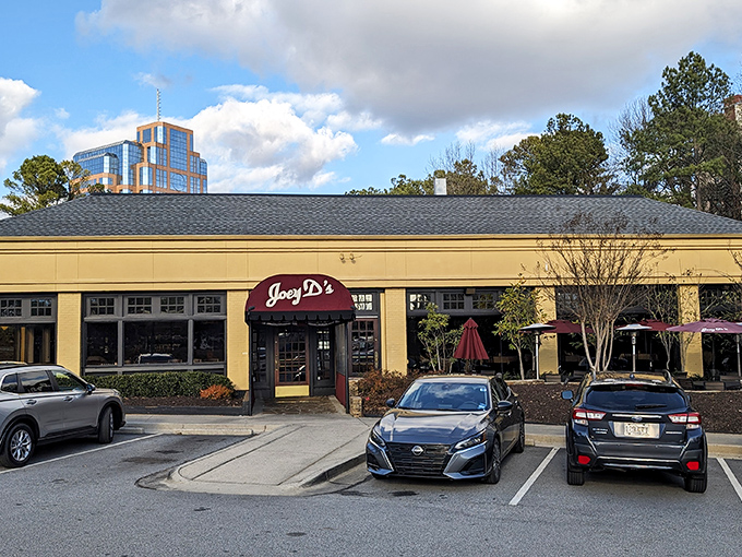 The iconic burgundy awning of Joey D's beckons like a culinary lighthouse in Dunwoody, promising comfort and indulgence just steps from the parking lot.