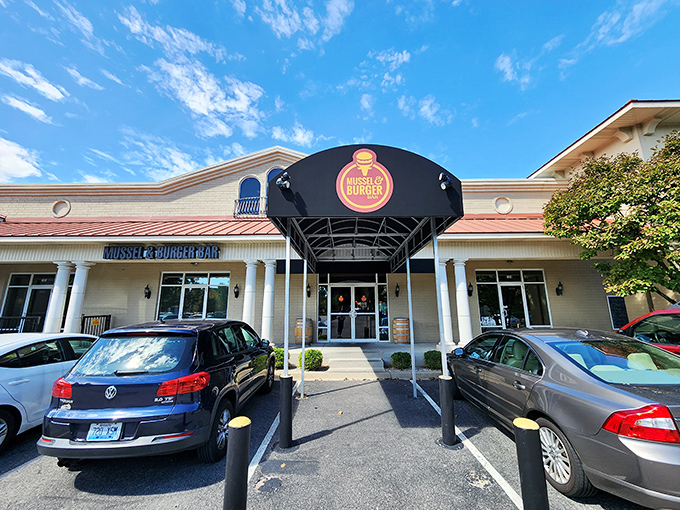 The unassuming exterior of Mussel & Burger Bar belies the culinary treasures within. Like finding a diamond in a strip mall setting.