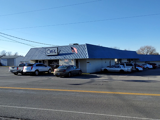 The unassuming blue-roofed exterior of Coe's Steak House stands like a beacon for hungry travelers. Kentucky's culinary treasures often hide in plain sight.