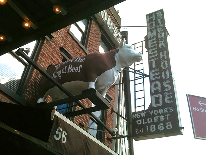 The historic brick facade of Old Homestead stands like a carnivore's beacon in the Meatpacking District. Those vintage lights have illuminated countless memorable evenings.
