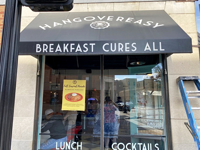 The black awning says it all: "BREAKFAST CURES ALL." At Hang Over Easy, they're not just making a promise—they're offering salvation by spatula.