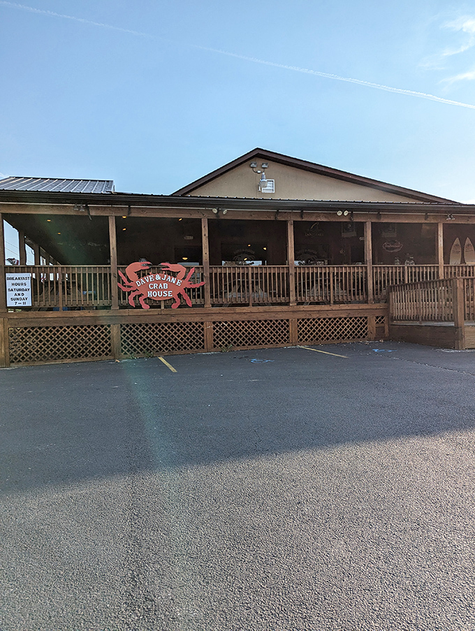 The unassuming exterior of Dave & Jane's Crabhouse beckons like a seafood siren, promising treasures within its wooden walls and wraparound porch.