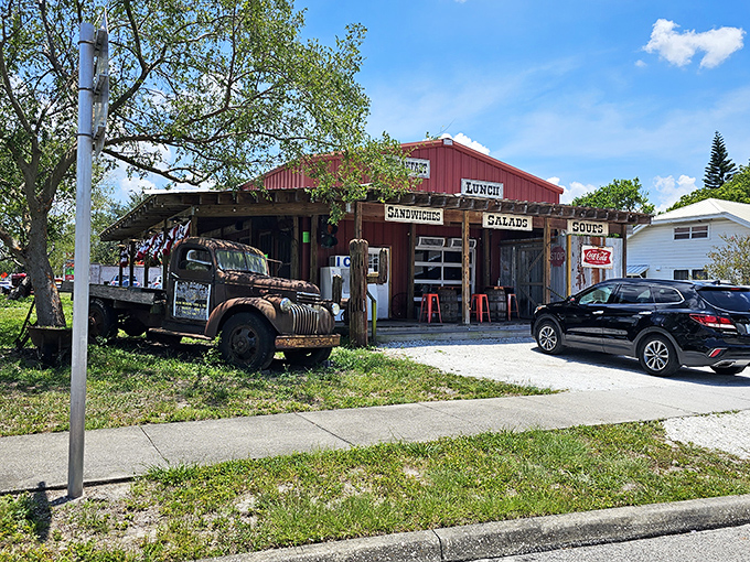 The rustic red exterior of Seminole Heights General Store beckons like a mirage in Tampa's urban landscape—a promise of simple pleasures and extraordinary sandwiches.