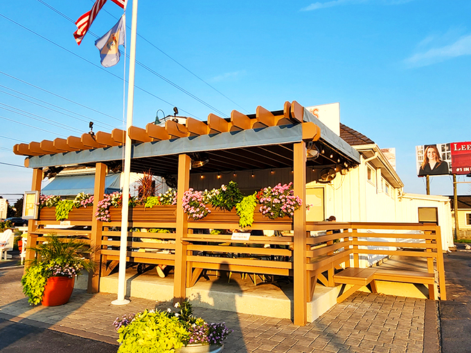 The American dream with a side of seafood! This unassuming coastal gem flies both Old Glory and Delaware's flag proudly above its "Fried Clams - Fresh Fish" promise.