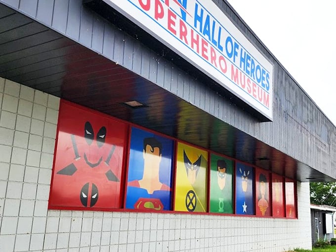 The unassuming exterior belies what waits inside - a façade featuring iconic superhero emblems that serve as a bat-signal to comic enthusiasts everywhere.