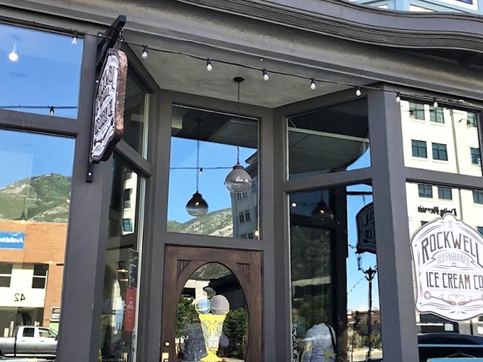 The storefront beckons like an ice cream oasis in downtown Provo, with mountains framing this temple of frozen delights.