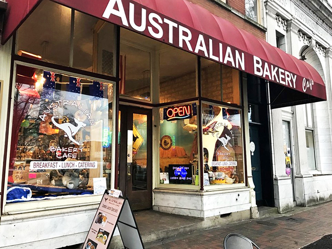 The red awning beckons like a culinary lighthouse on Marietta Square, promising authentic Down Under delights that'll make you forget you're in Georgia.