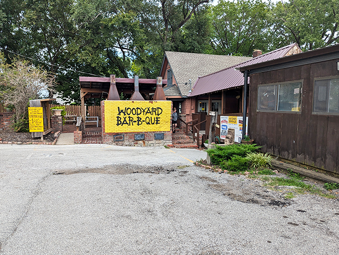That bright yellow wall isn't just eye-catching—it's a beacon for barbecue pilgrims. Woodyard's humble exterior houses smoking treasures that have made it a Kansas City legend.