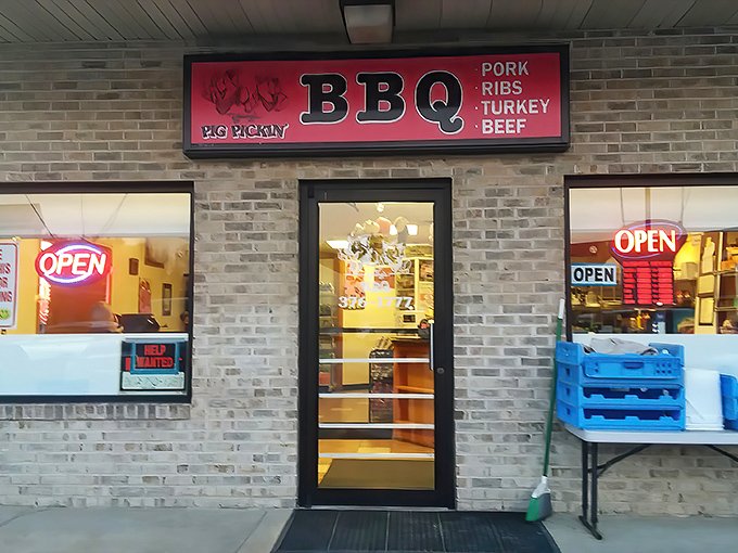 The pink sign beckons like a smoky siren call. Young's BBQ's unassuming brick exterior promises no frills—just exceptional barbecue waiting inside.