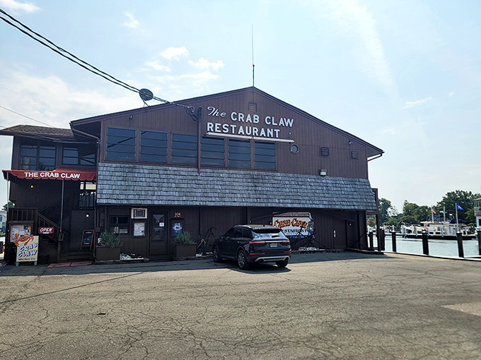 The iconic exterior of The Crab Claw stands like a beacon for seafood lovers, perched on stilts above the water as if to say, "Come hungry, leave happy."