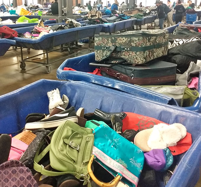 A paradise for purse enthusiasts – designer bags and vintage clutches waiting to be liberated from their blue bin limbo.