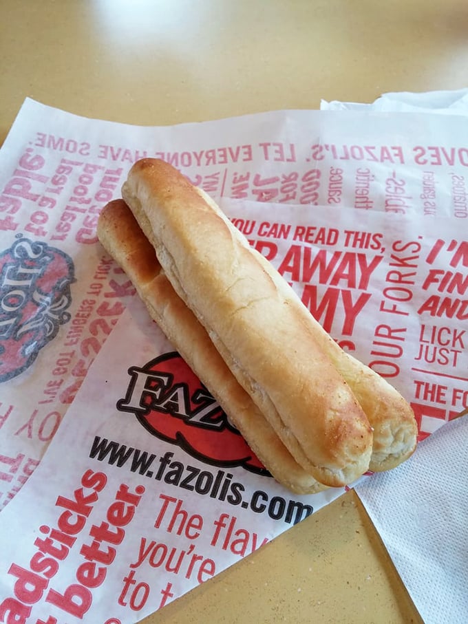 The breadstick that launched a thousand road trips. Warm, buttery, garlicky—and somehow always arriving just when you think you couldn't possibly eat another.