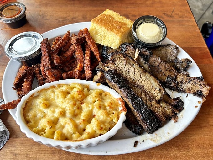 The barbecue trinity: brisket, mac and cheese, and cornbread—like the Three Tenors of comfort food, but with better sauce options.
