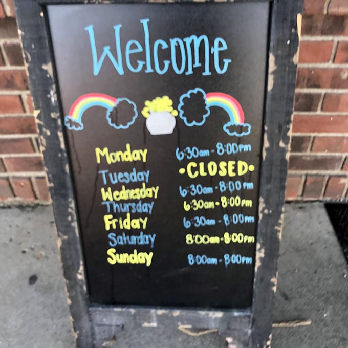 Operating hours written with the cheerfulness of someone who knows they're about to make your day delicious. Plan accordingly—Tuesday cravings require alternate scheduling.