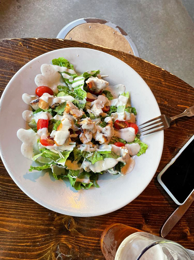 A Caesar salad that actually deserves its imperial name, with grilled chicken that didn't just visit the grill—it made friends there.