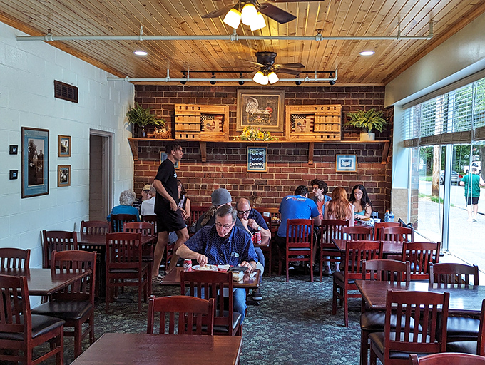 Where town meets gown—professors, students, and locals all surrender to the democratic appeal of perfectly fried chicken under that rustic ceiling.